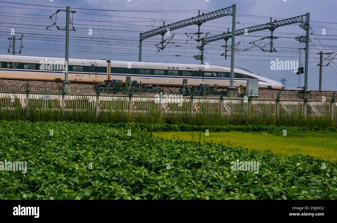 A Chinese CRRC built CRH380A bullet train leaves Jiaxing South Station ...