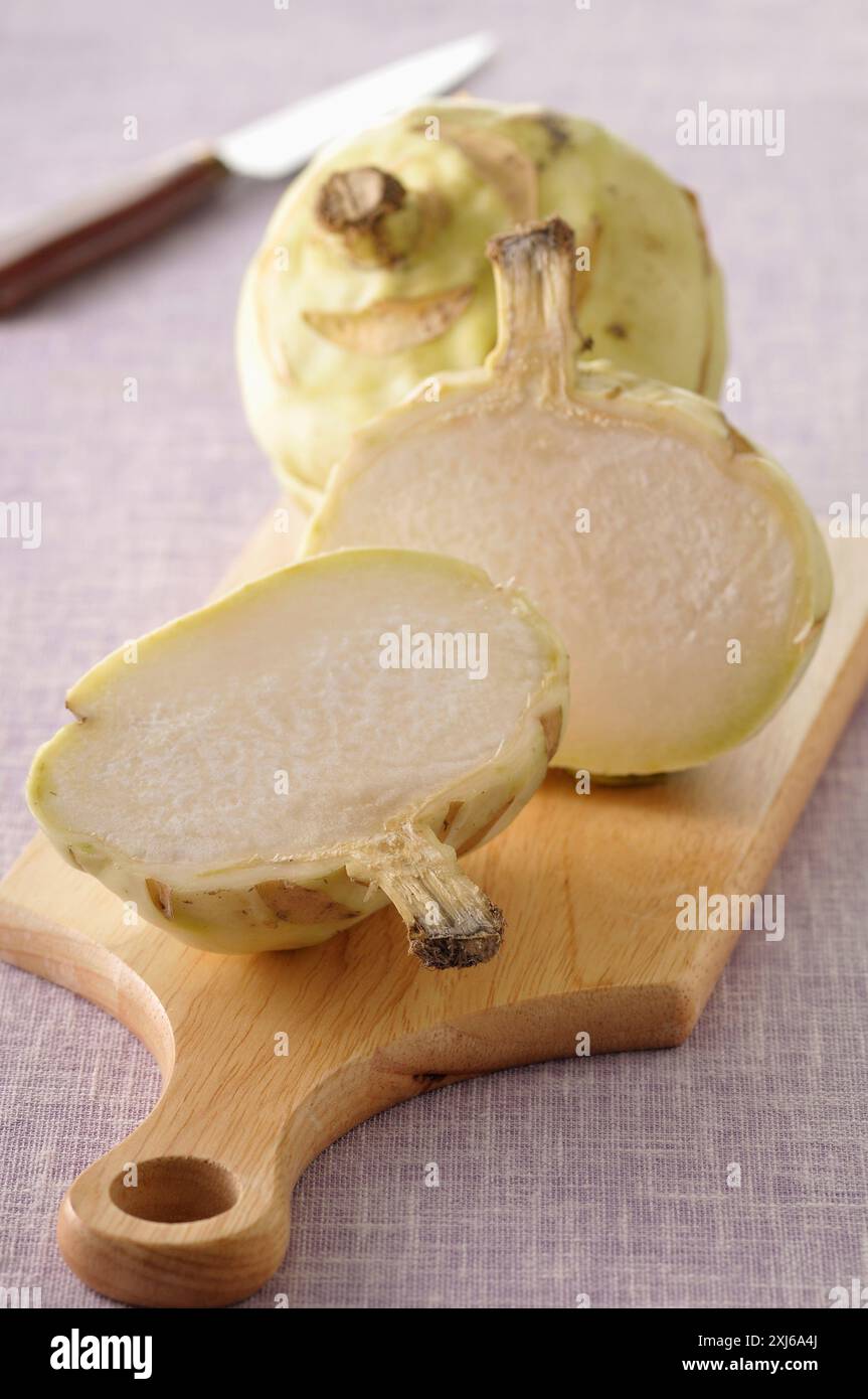 Cutting in half a Spanish turnip Stock Photo - Alamy