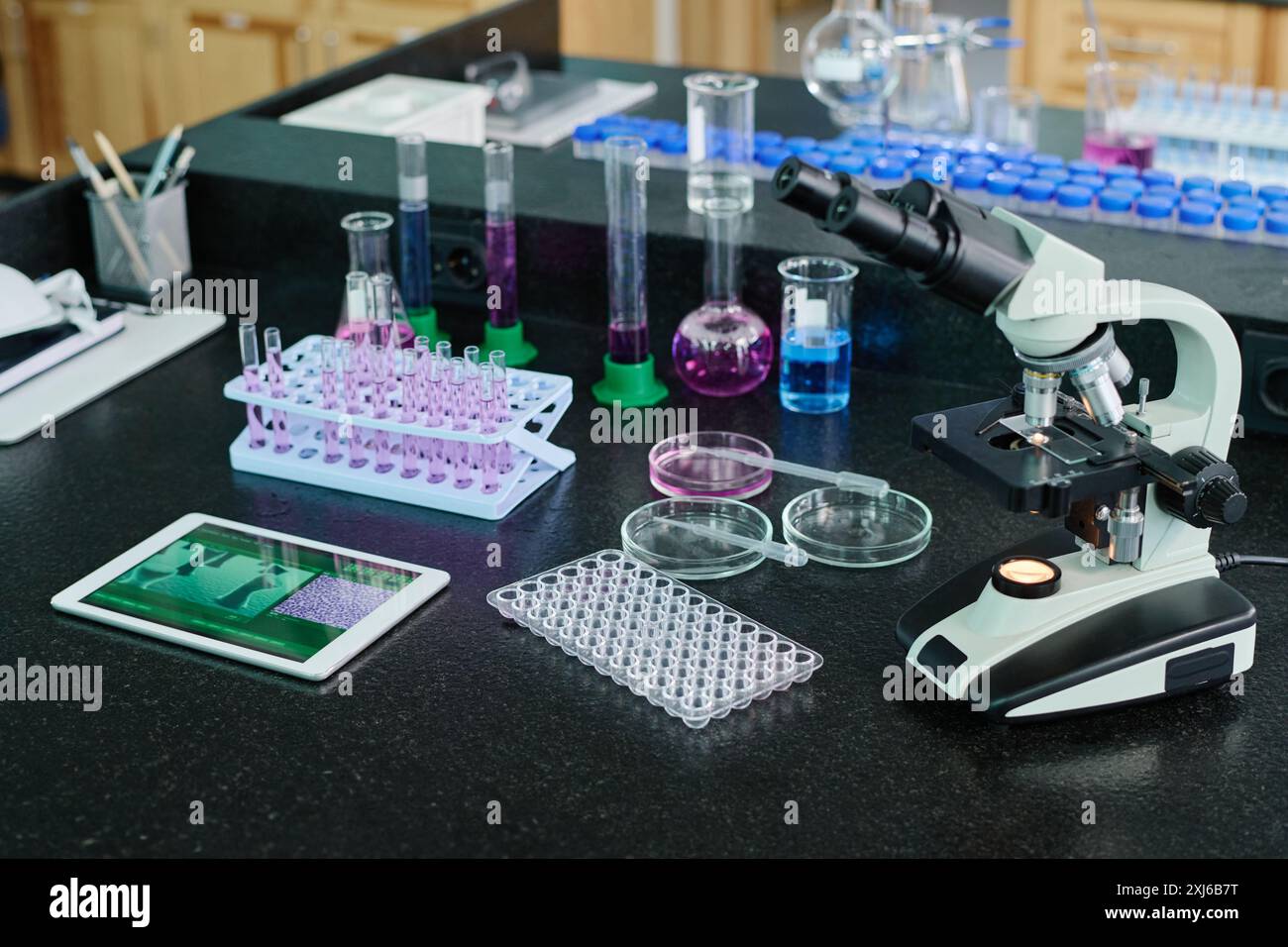 Workplace of modern scientist or researcher with microscope, Petri ...