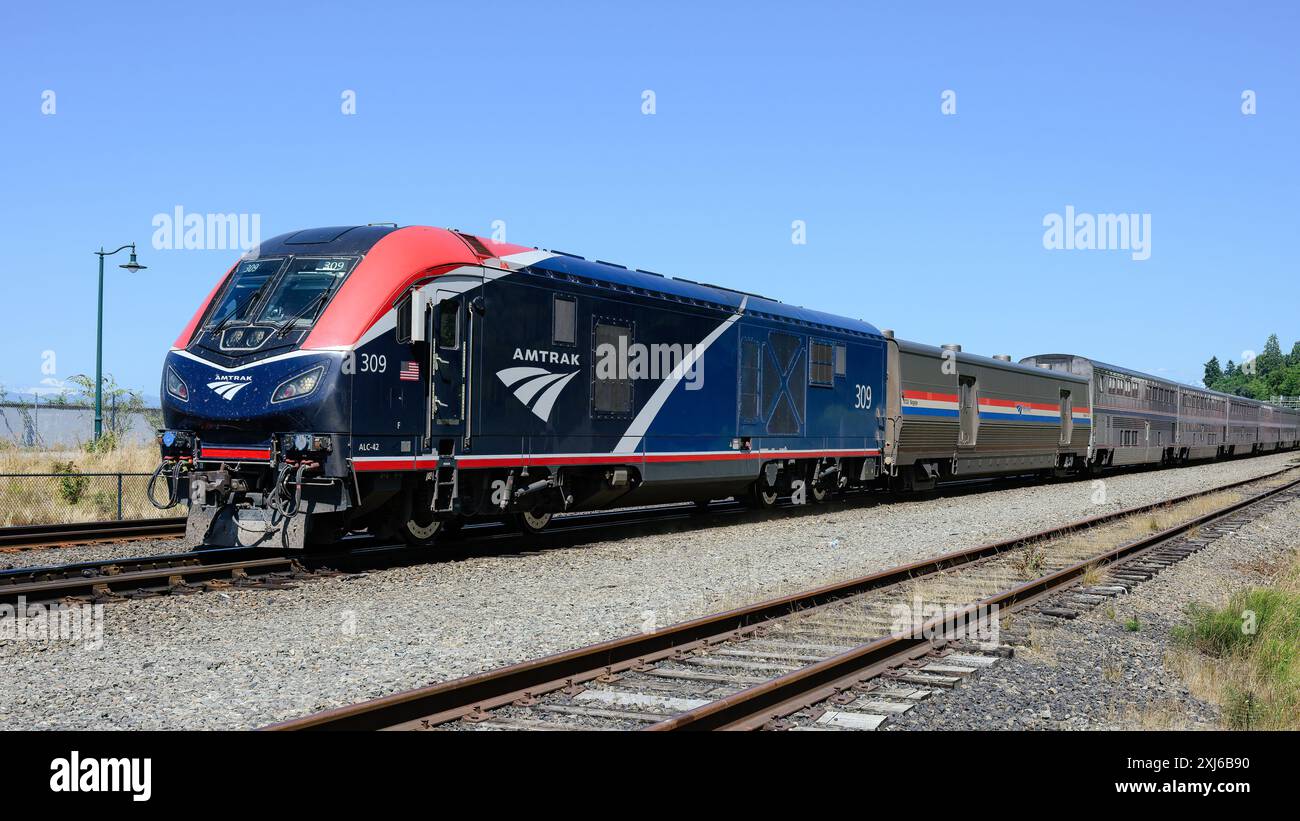 Mukilteo, WA, USA - July 11, 2024; Amtrak Empire Builder train with modern ALC-42 locomotive in ...