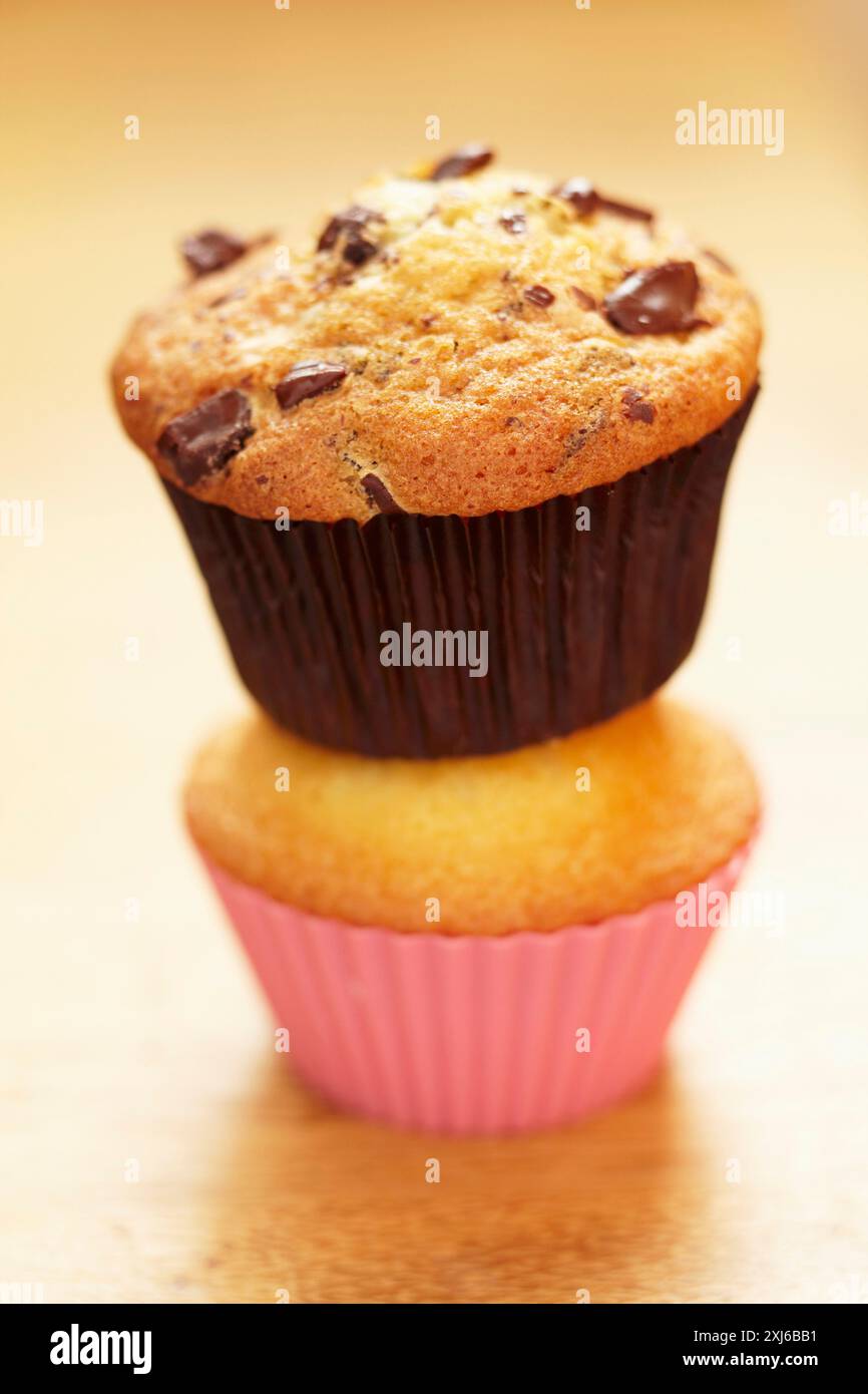 Chocolate chip muffin on a plain muffin Stock Photo - Alamy