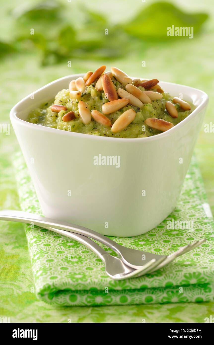 Zucchini mousse with pesto and pine nuts Stock Photo - Alamy