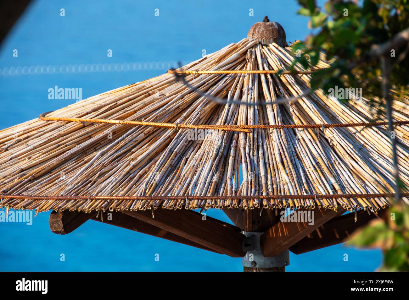 Detailed image capturing the intricate craftsmanship of a thatched ...