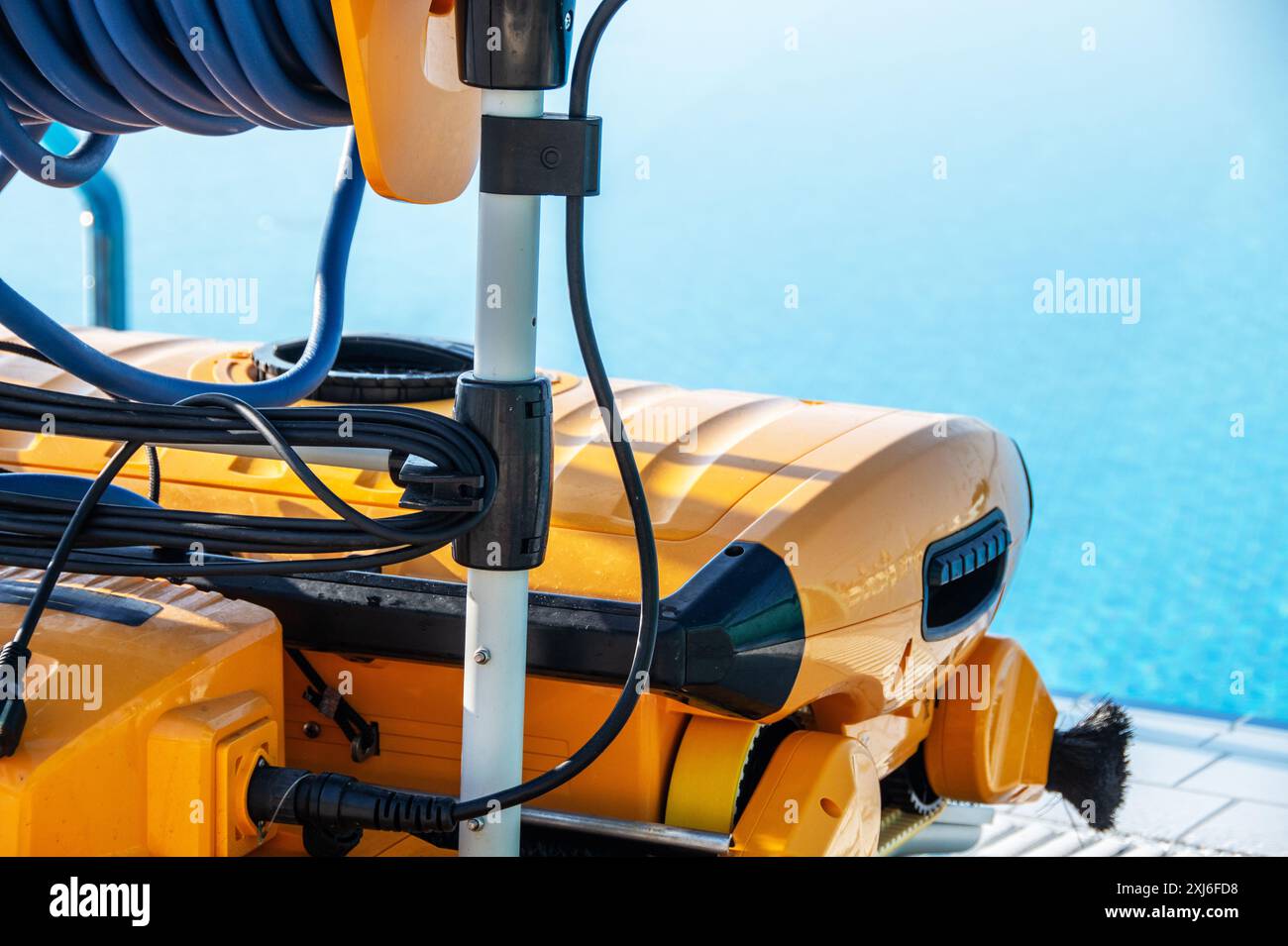 Close-up shot of a high-tech robotic pool cleaner, equipped with ...