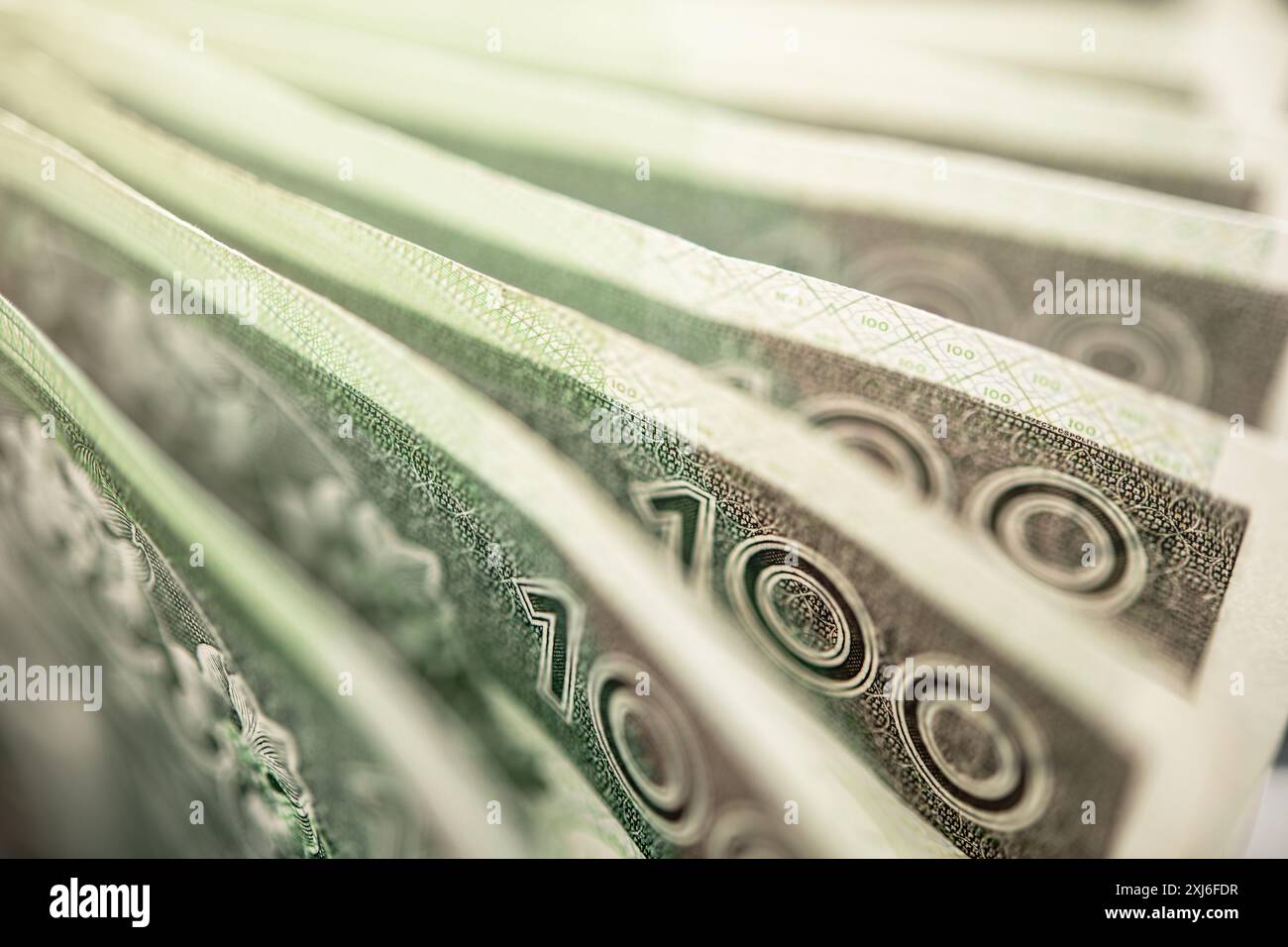 Macro shot showcases the intricate design and textures of stacked 100 ...