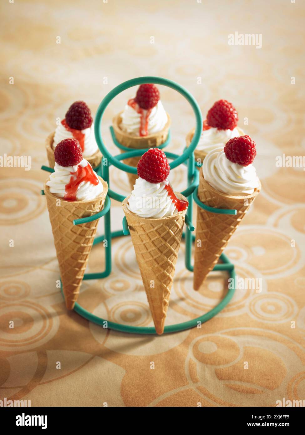 Ice cream cones with raspberry puree Stock Photo - Alamy