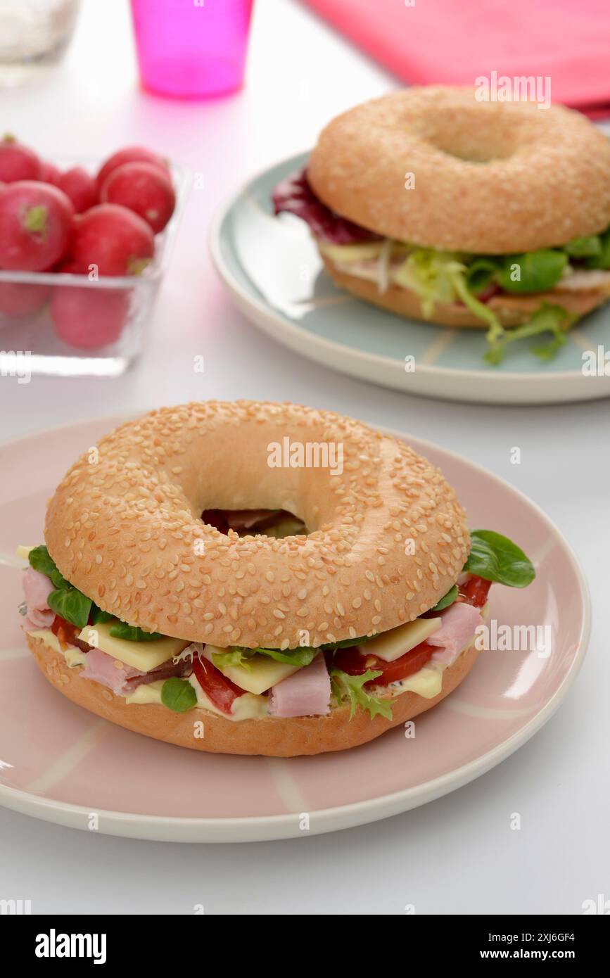 Ham,cheese,tomato and lettuce bagel sandwich Stock Photo - Alamy