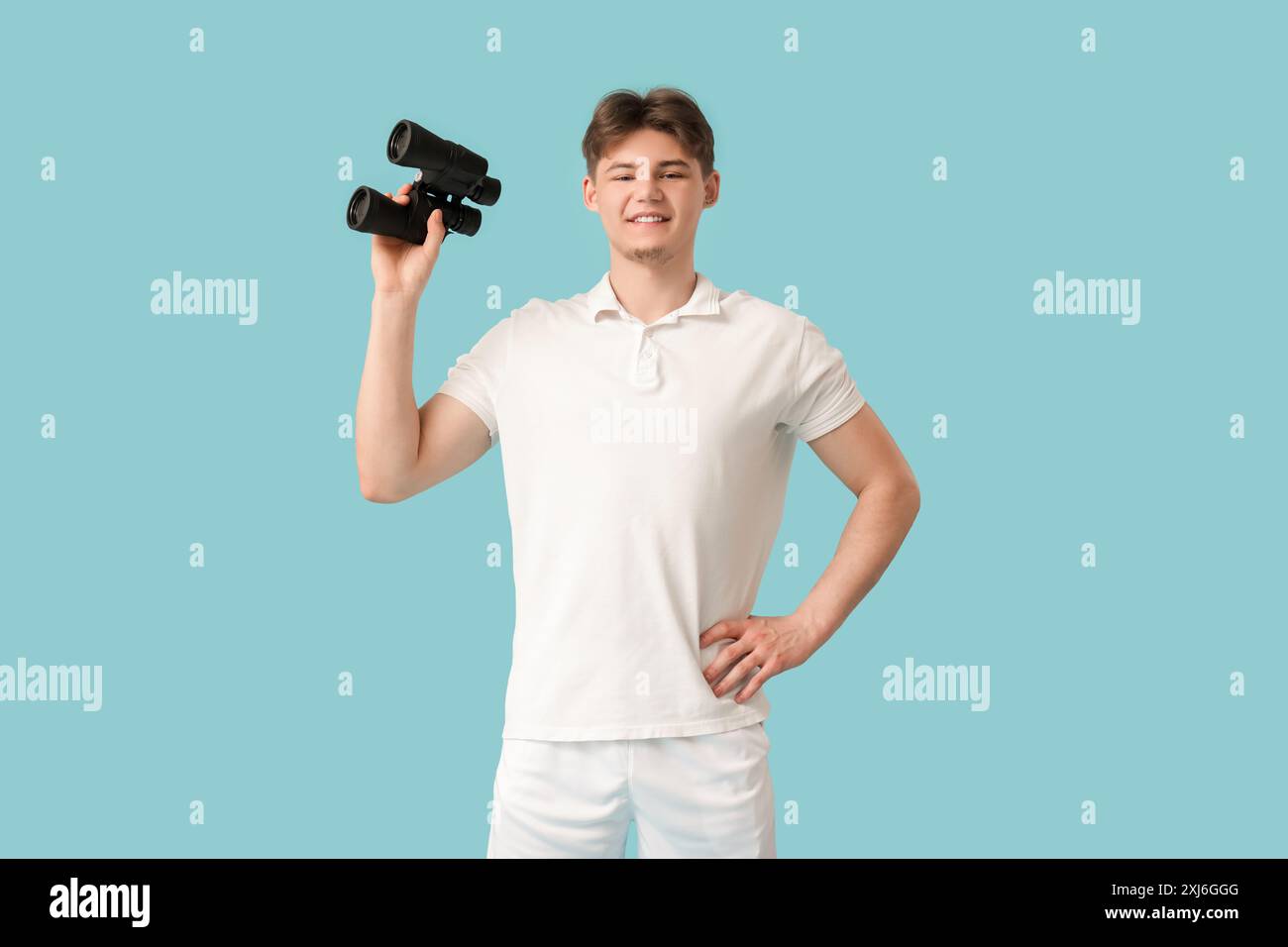 Male lifeguard with binoculars on blue background Stock Photo - Alamy
