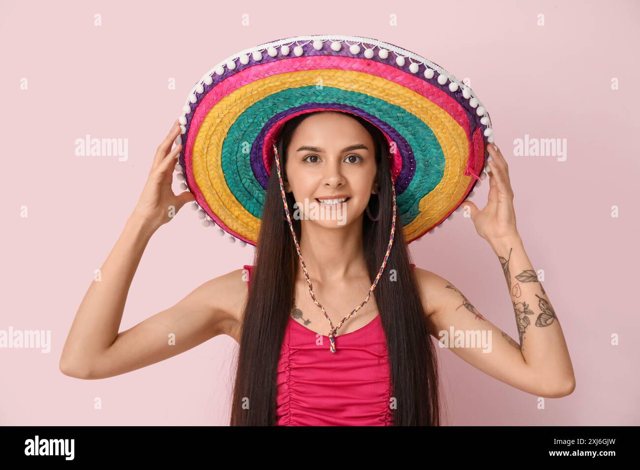 Beautiful young woman in Mexican sombrero hat on pink background Stock ...