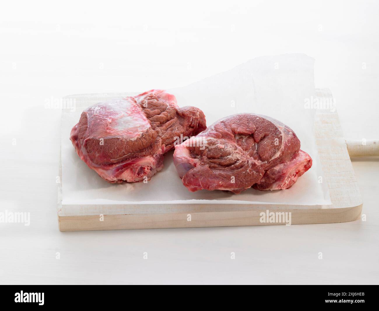 Raw pork cheeks Stock Photo - Alamy