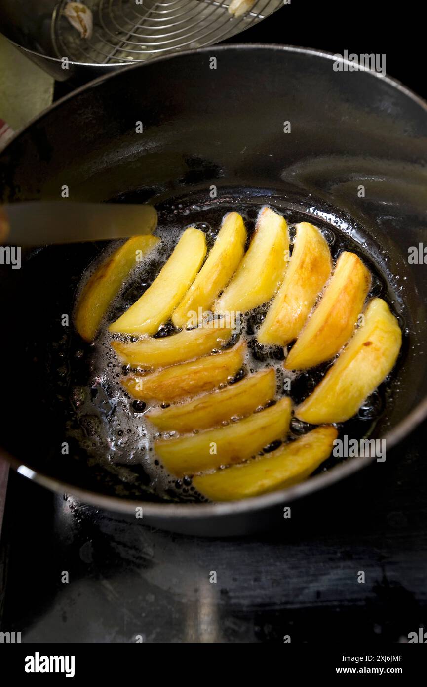 Cooking french fries in goose fat Stock Photo - Alamy