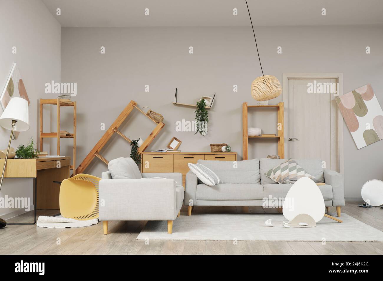 Interior of messy living room with overturned furniture after ...