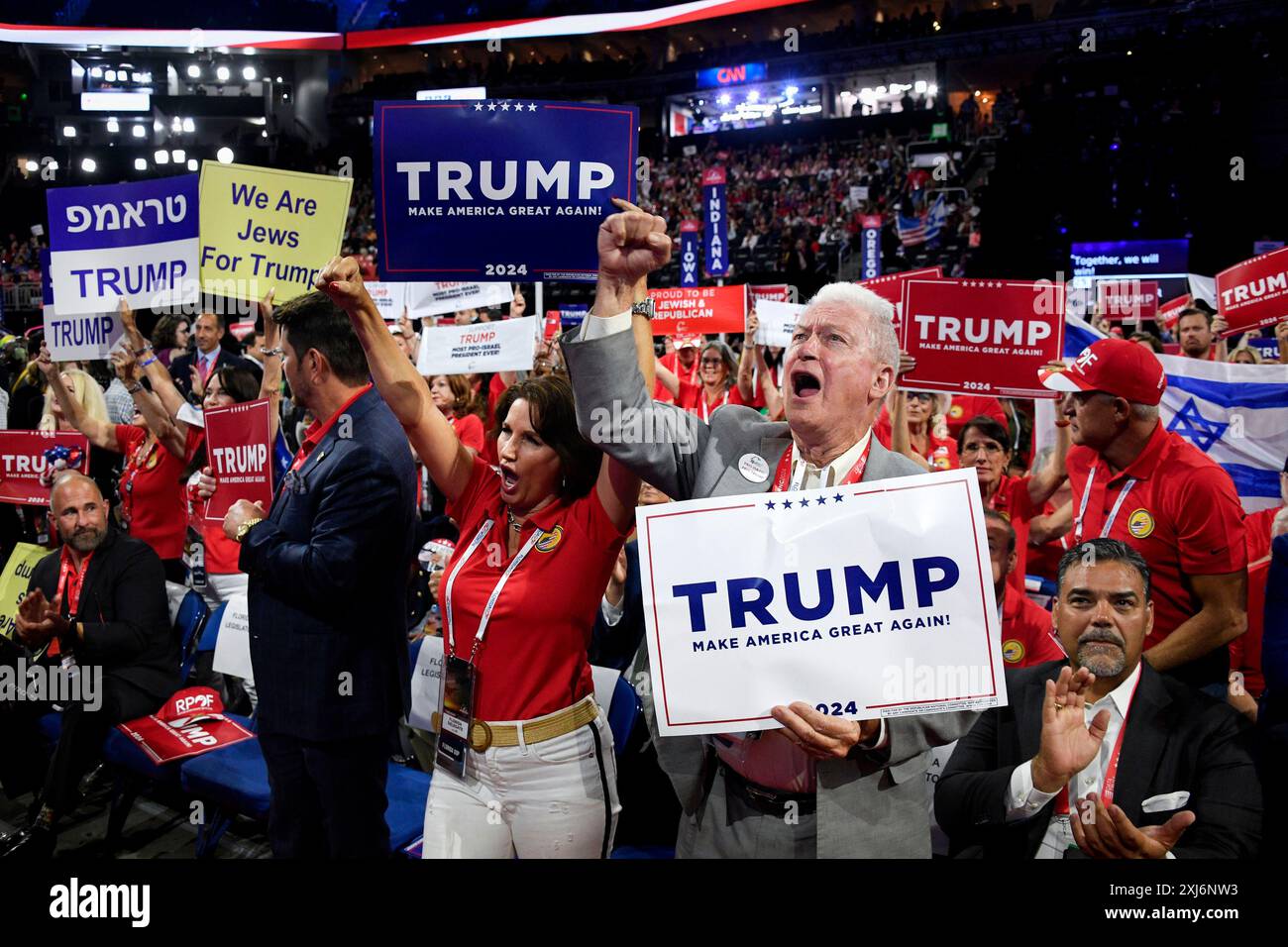 Milwaukee, United States. 16th July, 2024. Delegates raise posters and ...
