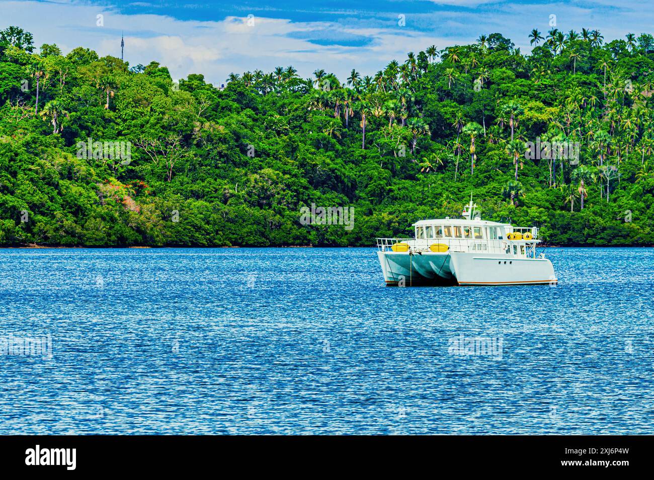 Boat anchored off the coast of Haligi Beach, Puerto Galera, Mindoro ...