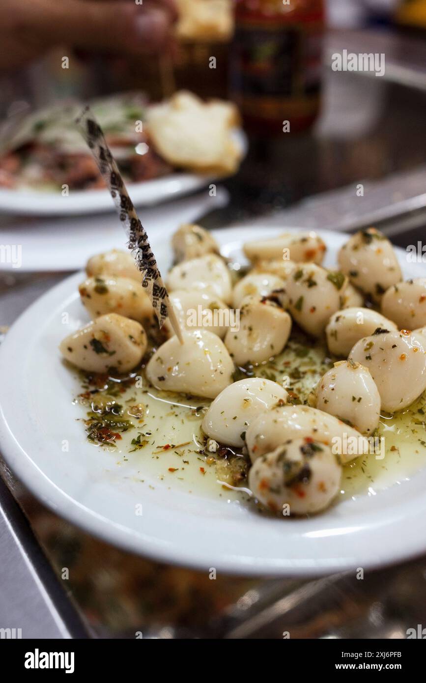 Marinated mild garlic tapas Stock Photo - Alamy