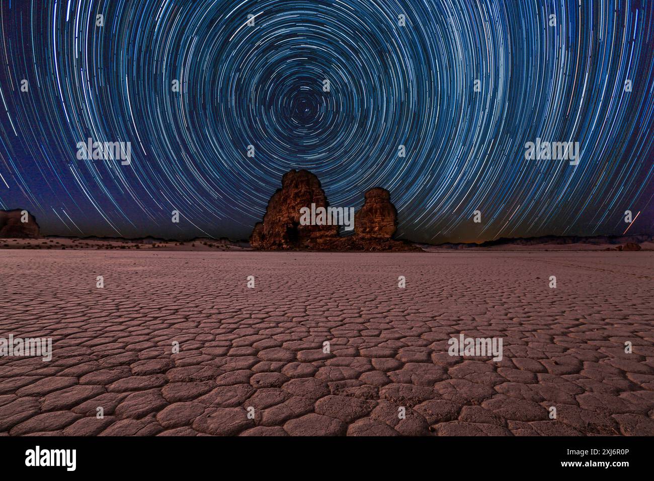 Star trail over a desert landscape at night, Saudi Arabia Stock Photo ...