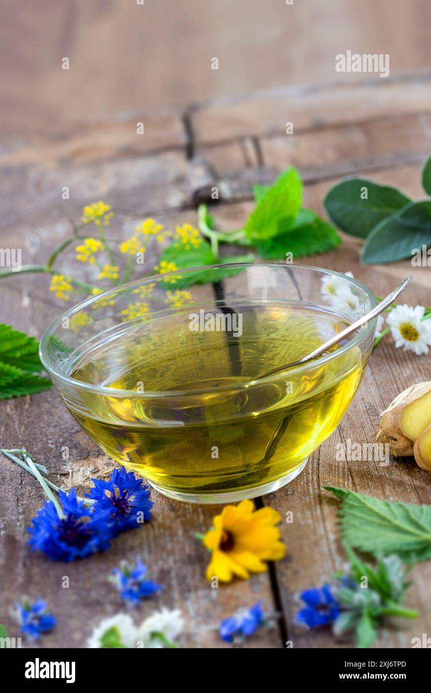 Infusion of mixed flowers and healing plants Stock Photo - Alamy