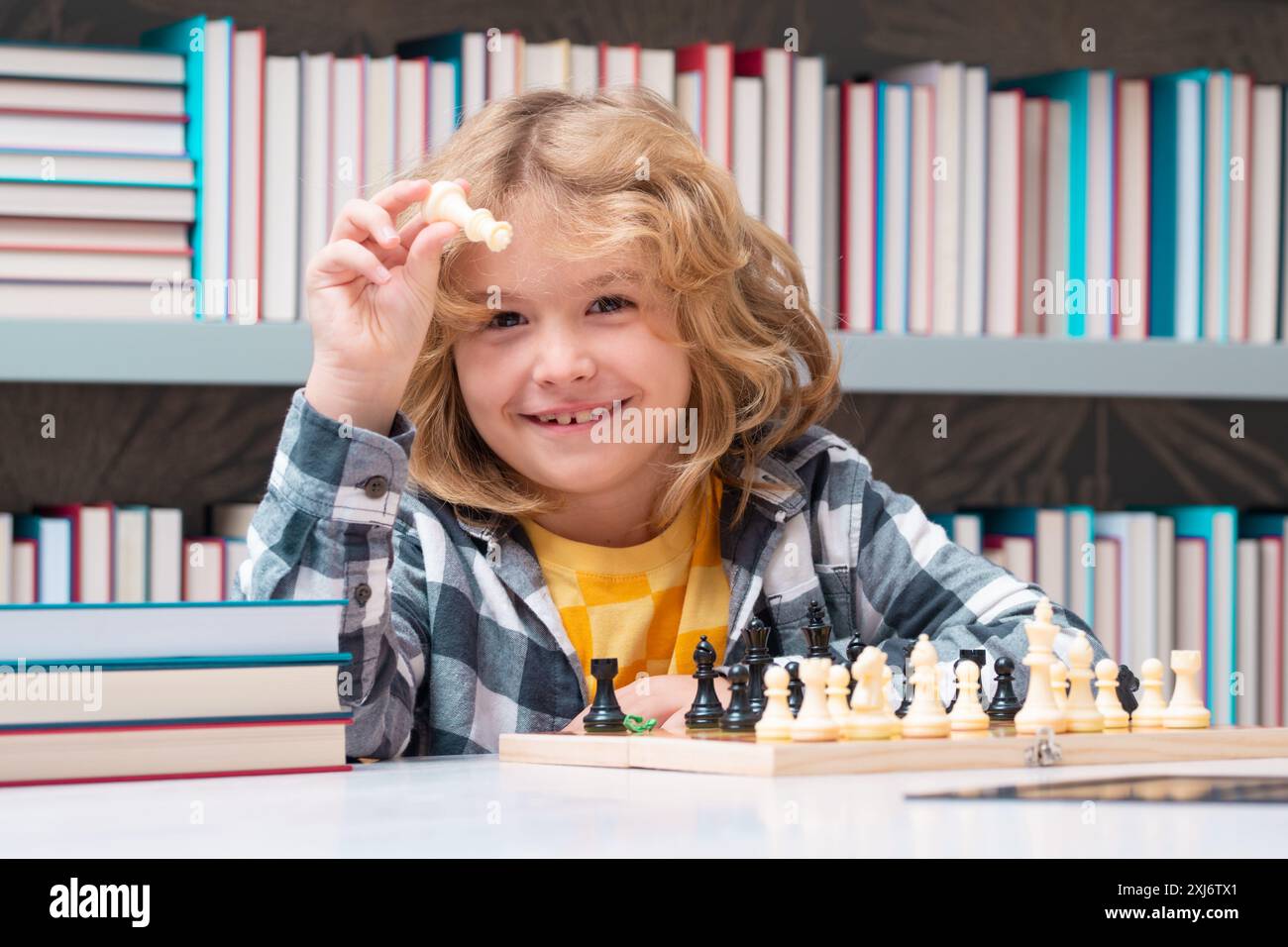 Chess school for kids. Chess for intelligent kid. Child genius, smart pupil playing logic board ...