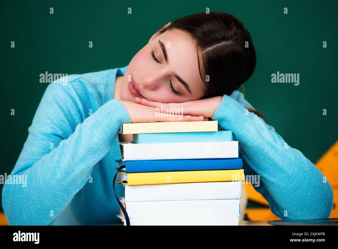 Student sleeping during a lecture in a classroom. Portrait of tired ...