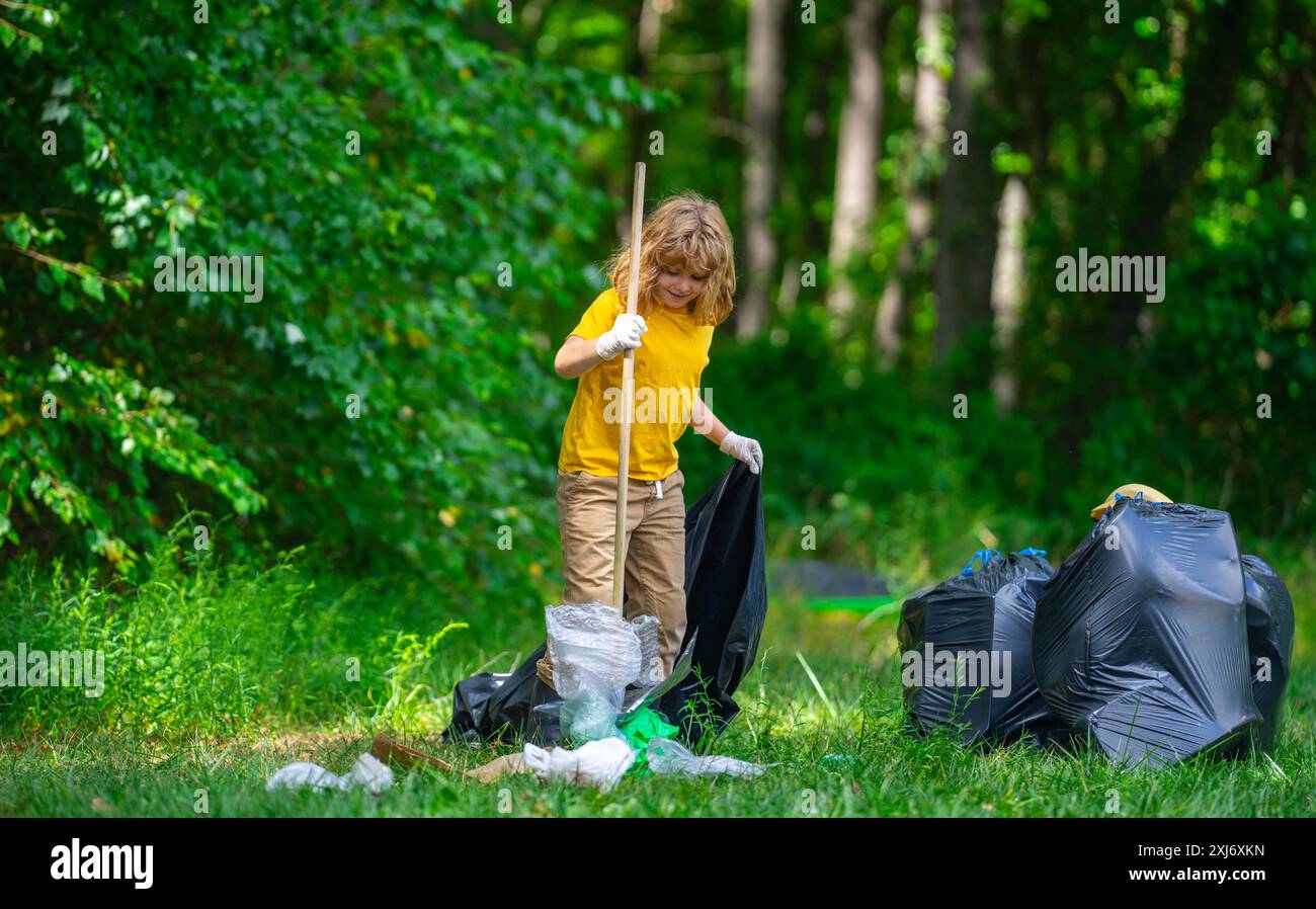 Child picking up garbage in park hi-res stock photography and images ...