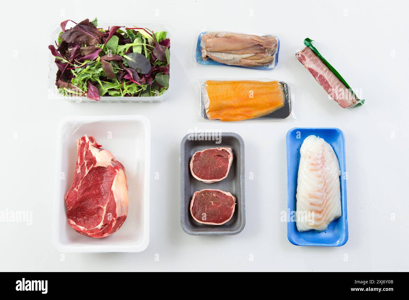 Composition with packed food on a white background Stock Photo - Alamy