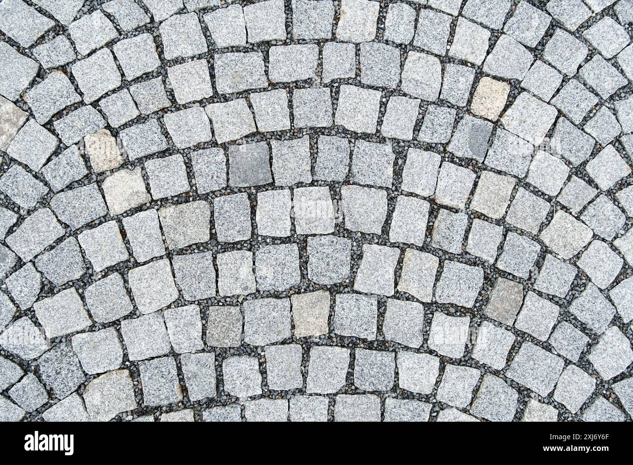Granite stone paved pedestrian pathway, typical urban road surface in ...