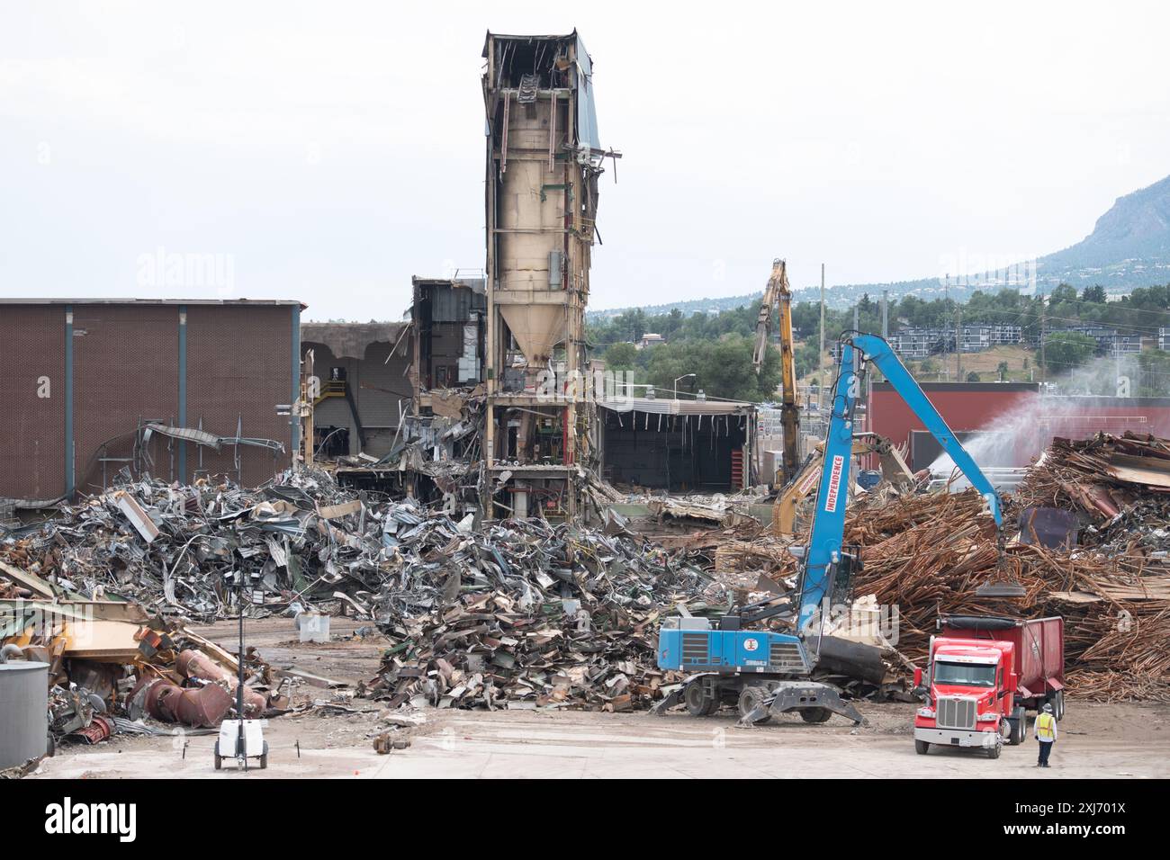 Demolition crews process and remove tons of materials from the ...
