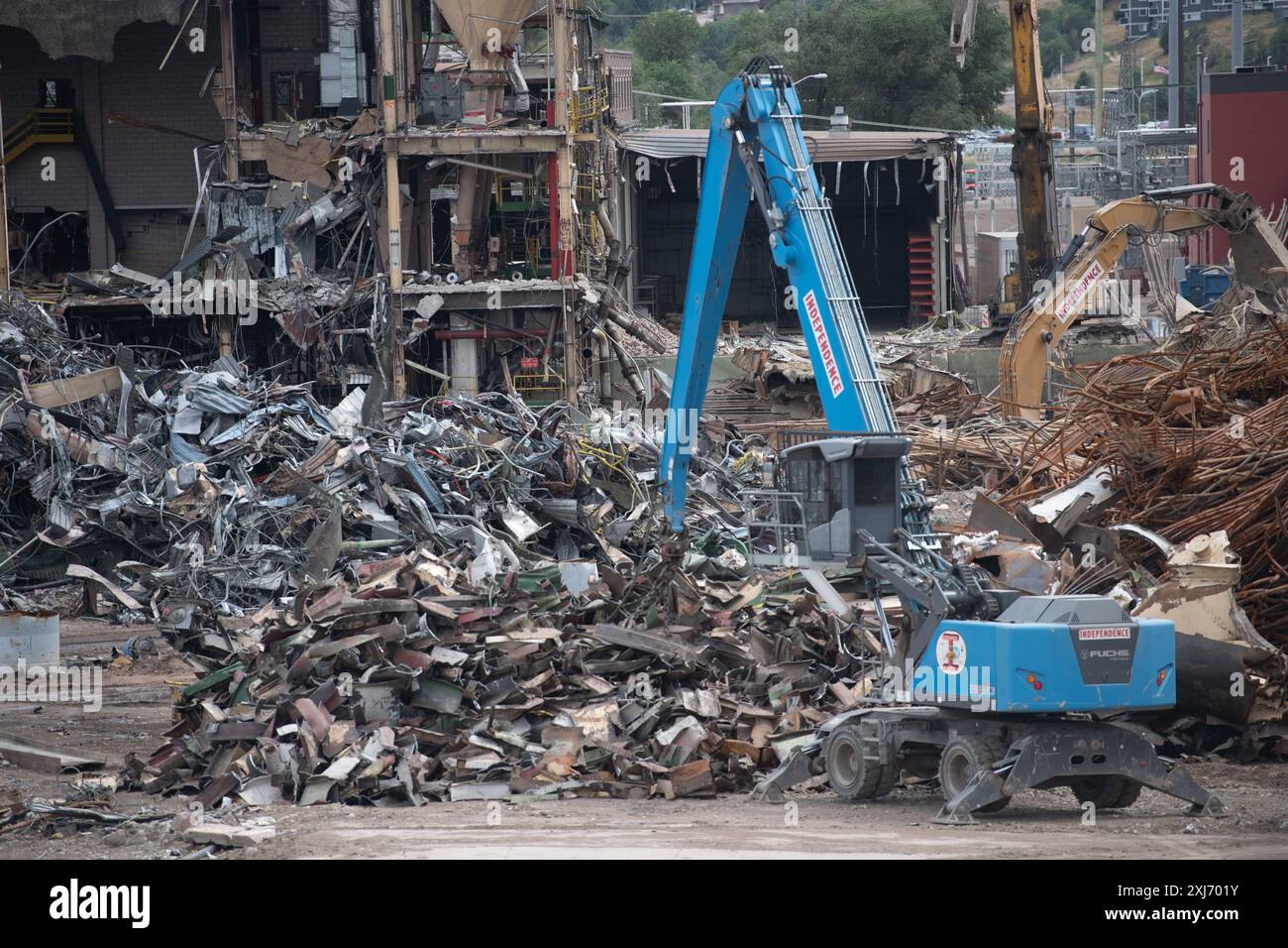 Demolition crews process and remove tons of materials from the ...