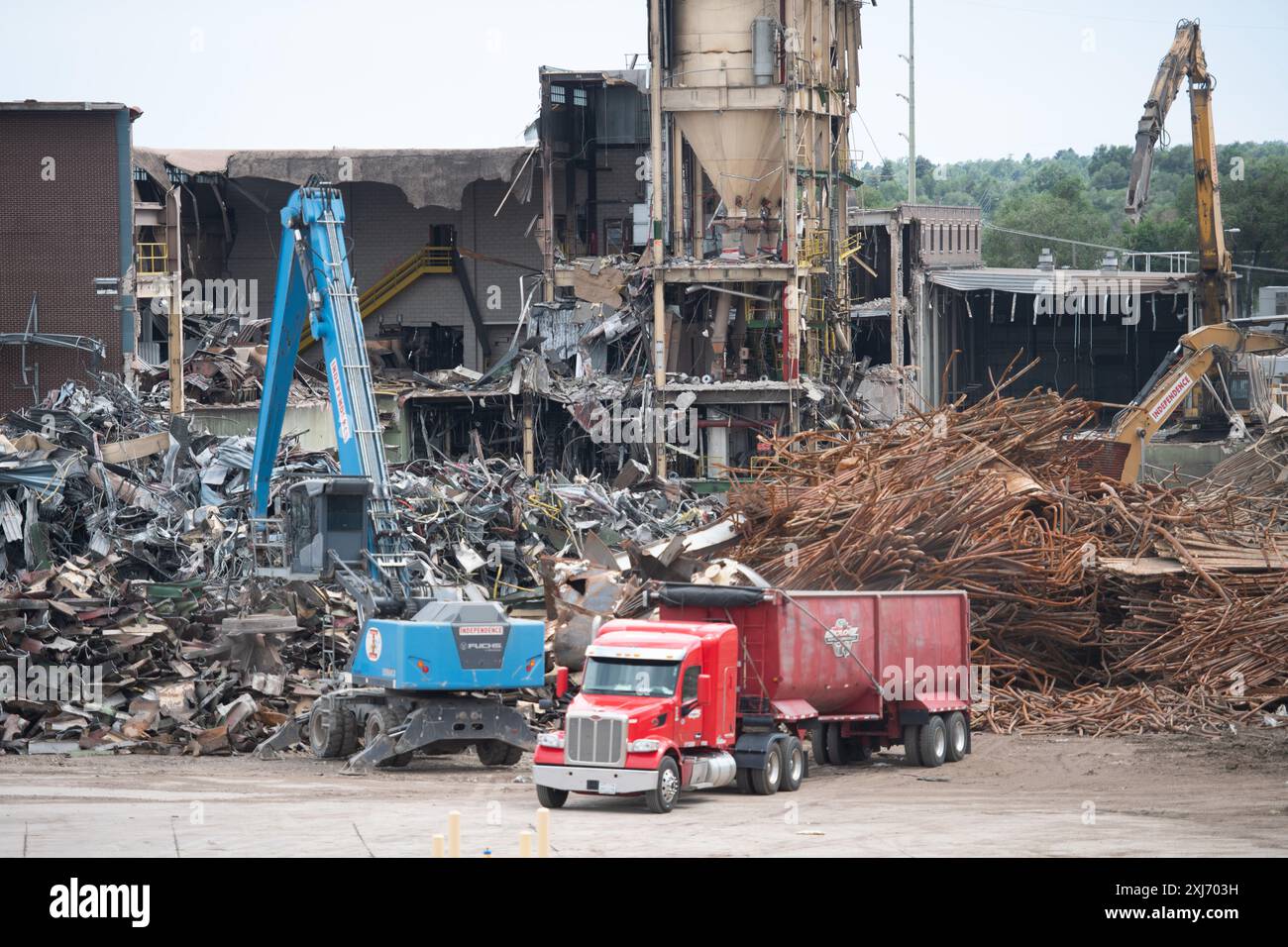 Demolition crews process and remove tons of materials from the ...