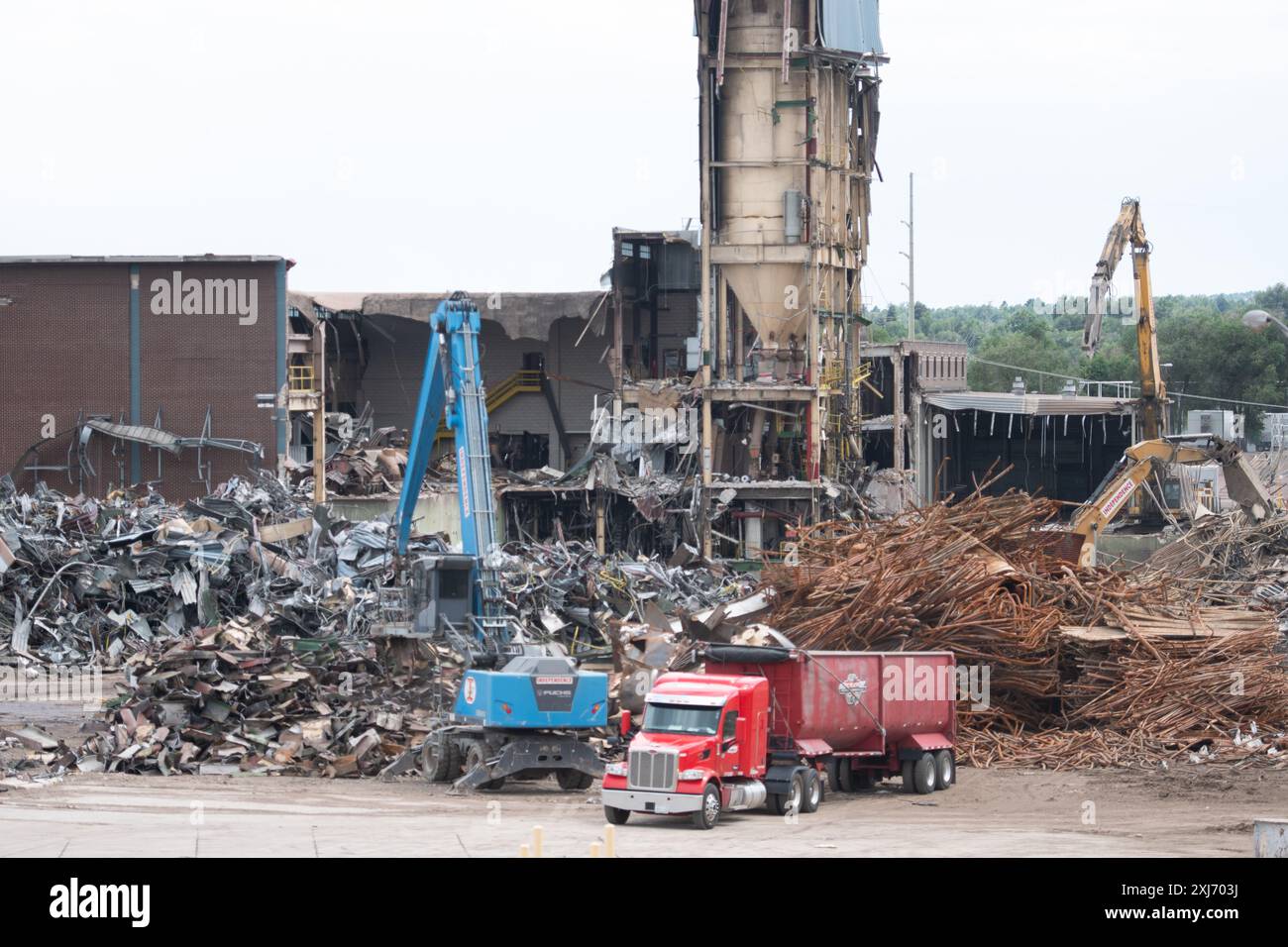 Demolition crews process and remove tons of materials from the ...
