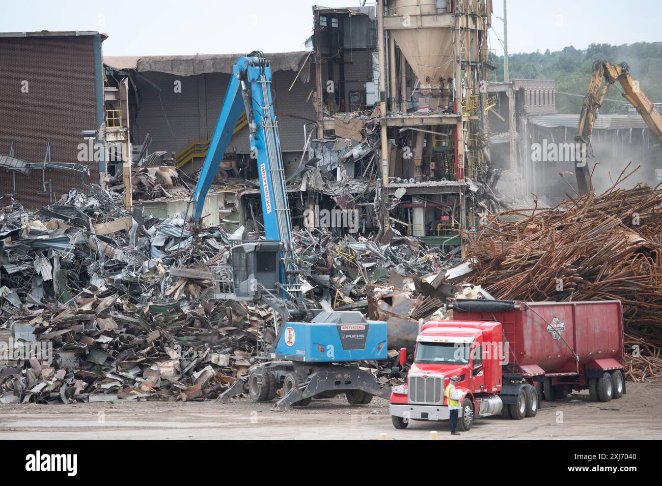 Demolition crews process and remove tons of materials from the ...