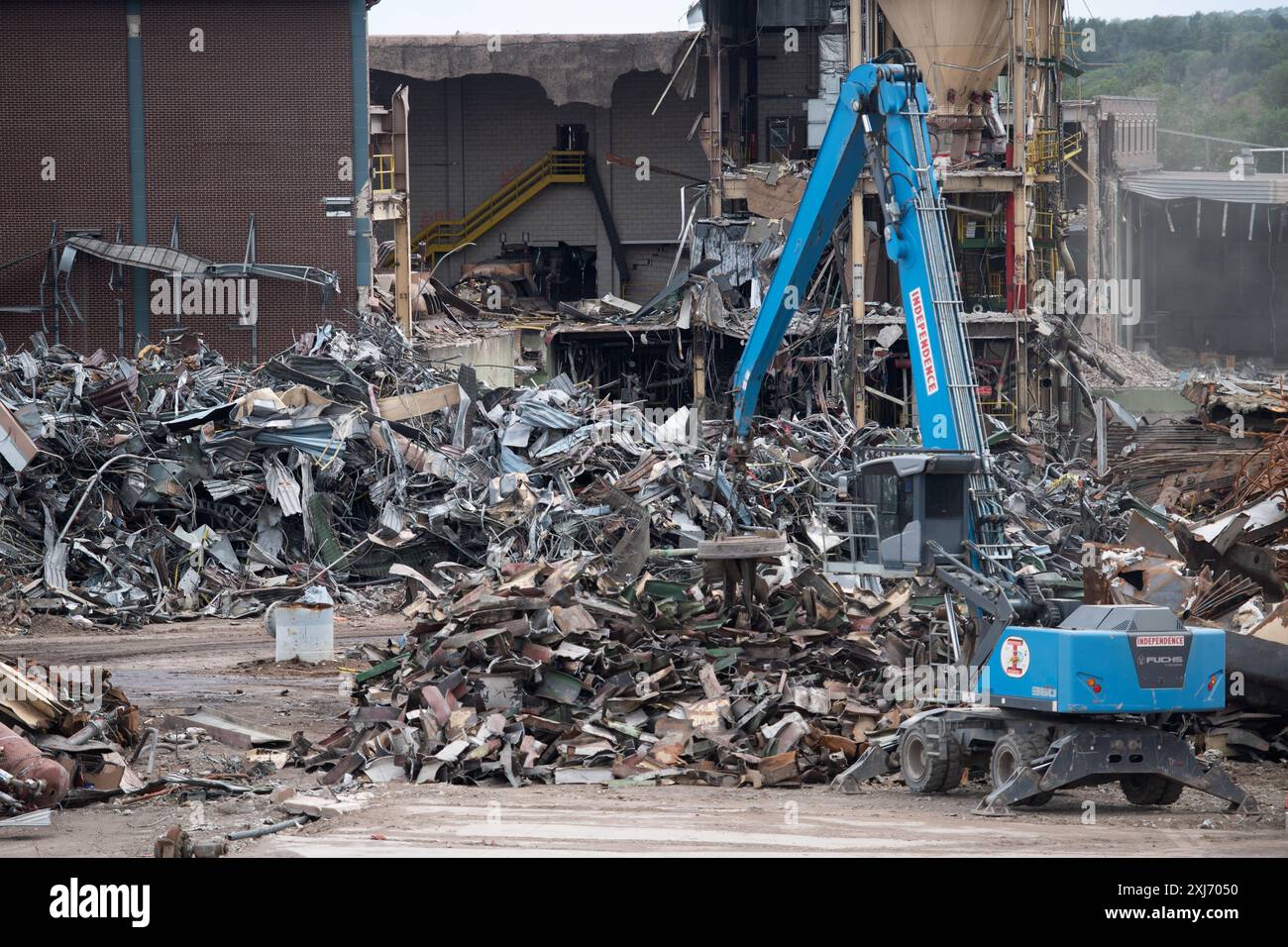Demolition crews process and remove tons of materials from the ...