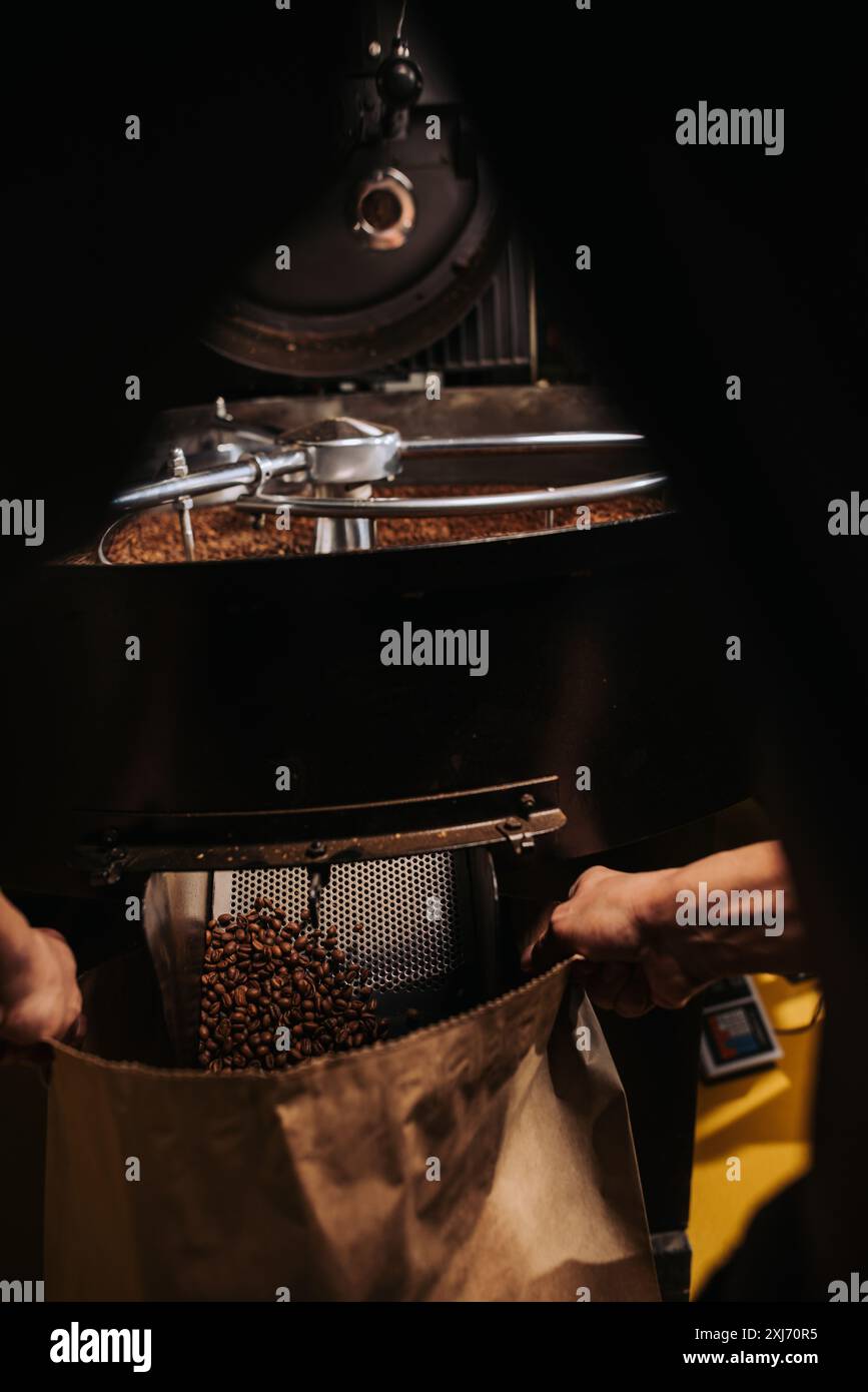 partial view of coffee roaster working on roasting machine Stock Photo ...