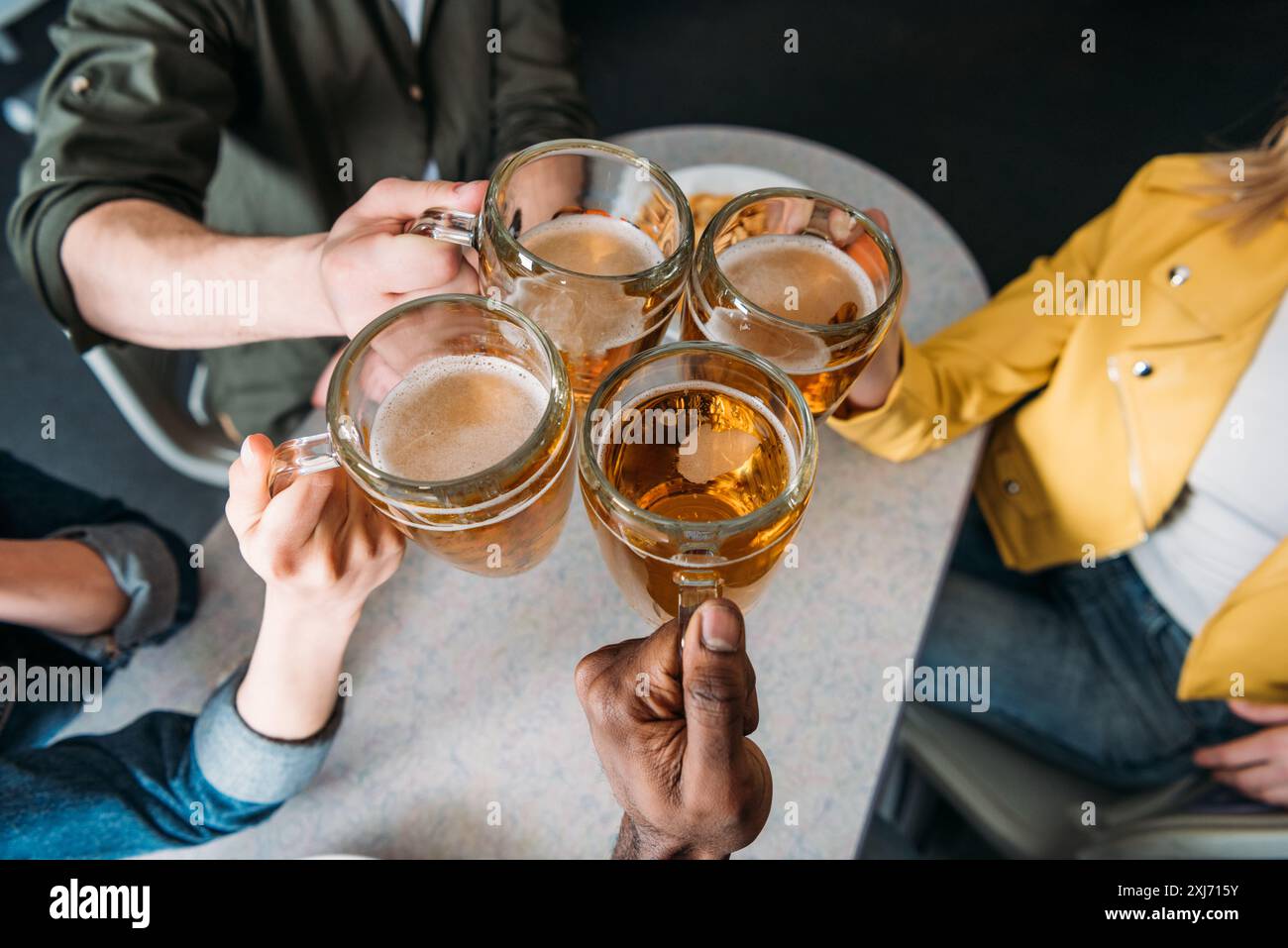 Mugs clinking hi-res stock photography and images - Alamy
