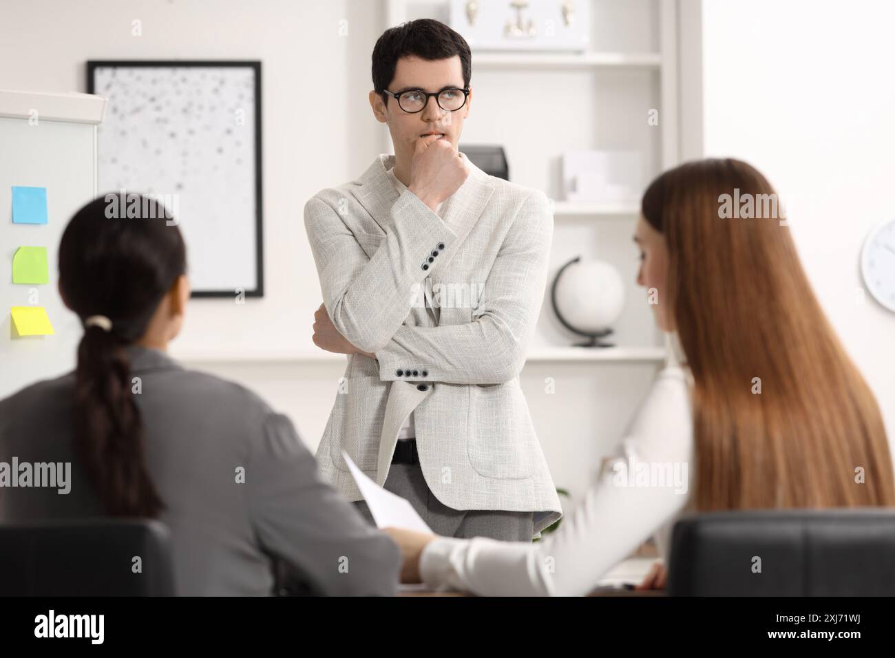 Man feeling embarrassed during business meeting in office Stock Photo ...