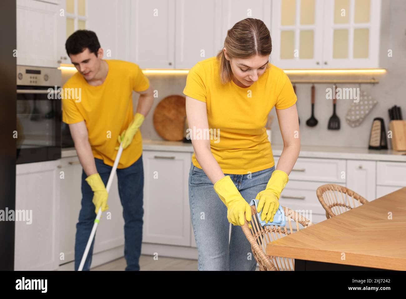 Professional janitors working in kitchen. Cleaning service Stock Photo ...