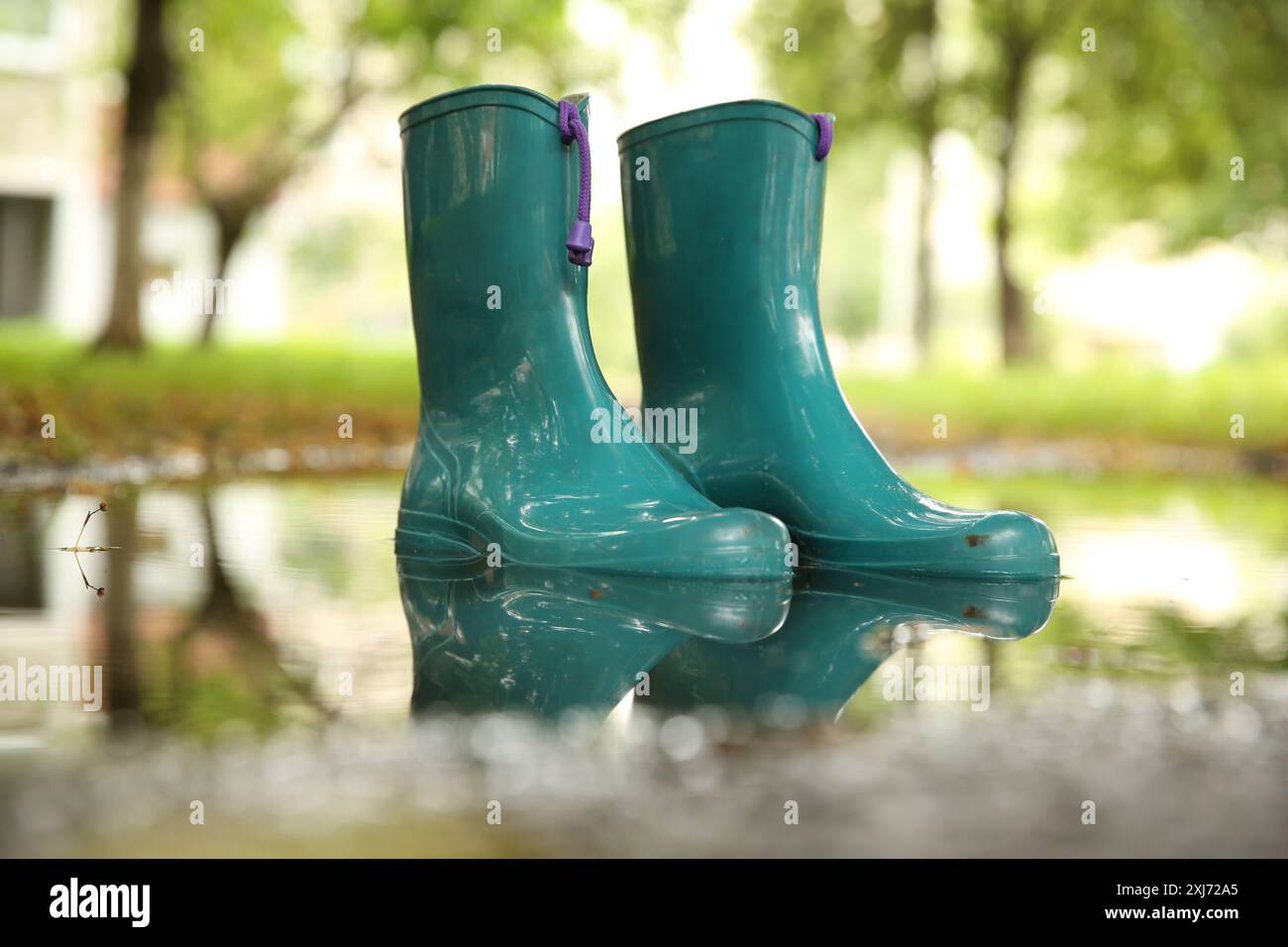 Toddler with rubber boots hi-res stock photography and images - Alamy