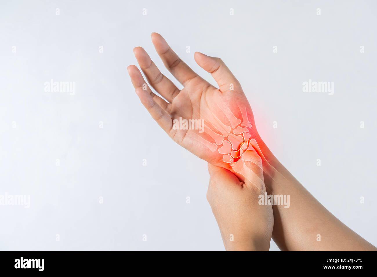 Closeup of male arms holding his painful wrist caused by prolonged work ...
