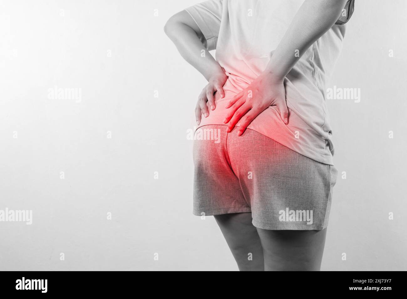 Hemorrhoids Disease Pain And Trouble. Woman hand holding her bottom ...