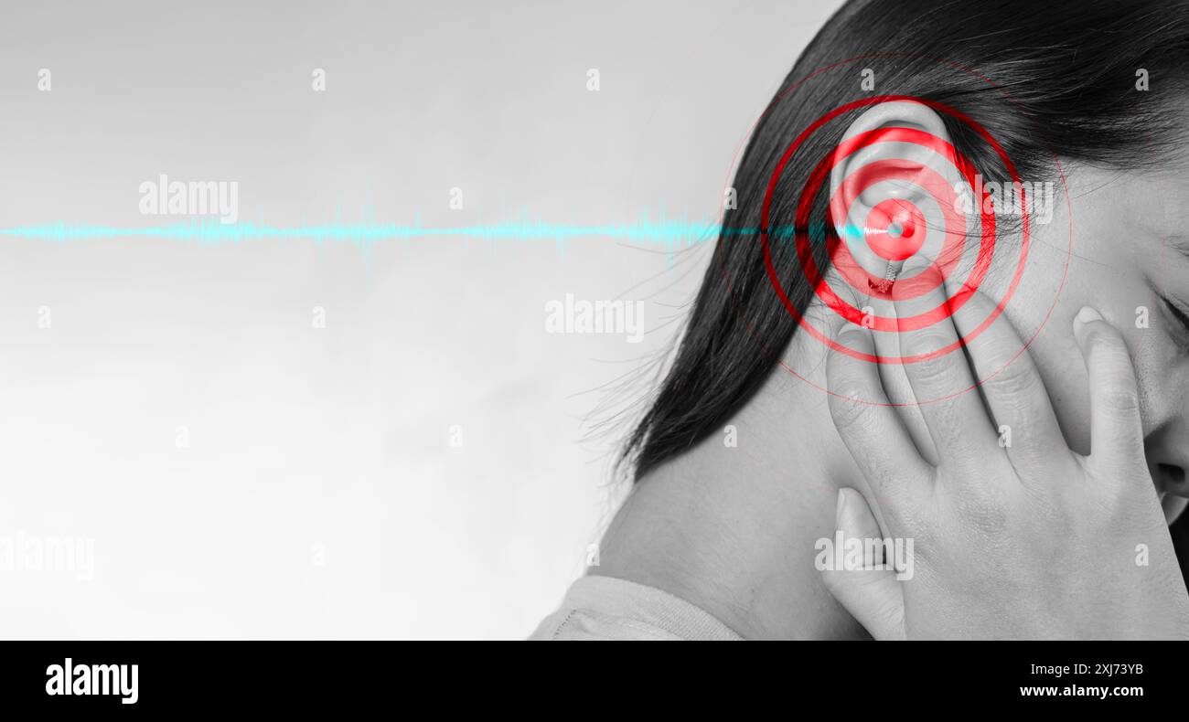 Noise Pollution, a Health Threat. Young woman suffering from ear pain ...