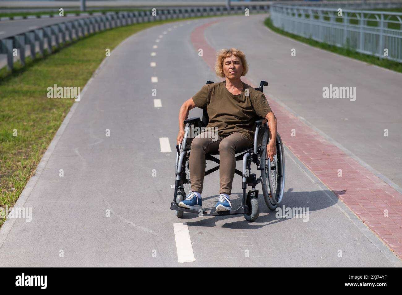 Bike lane wheelchair hi-res stock photography and images - Alamy