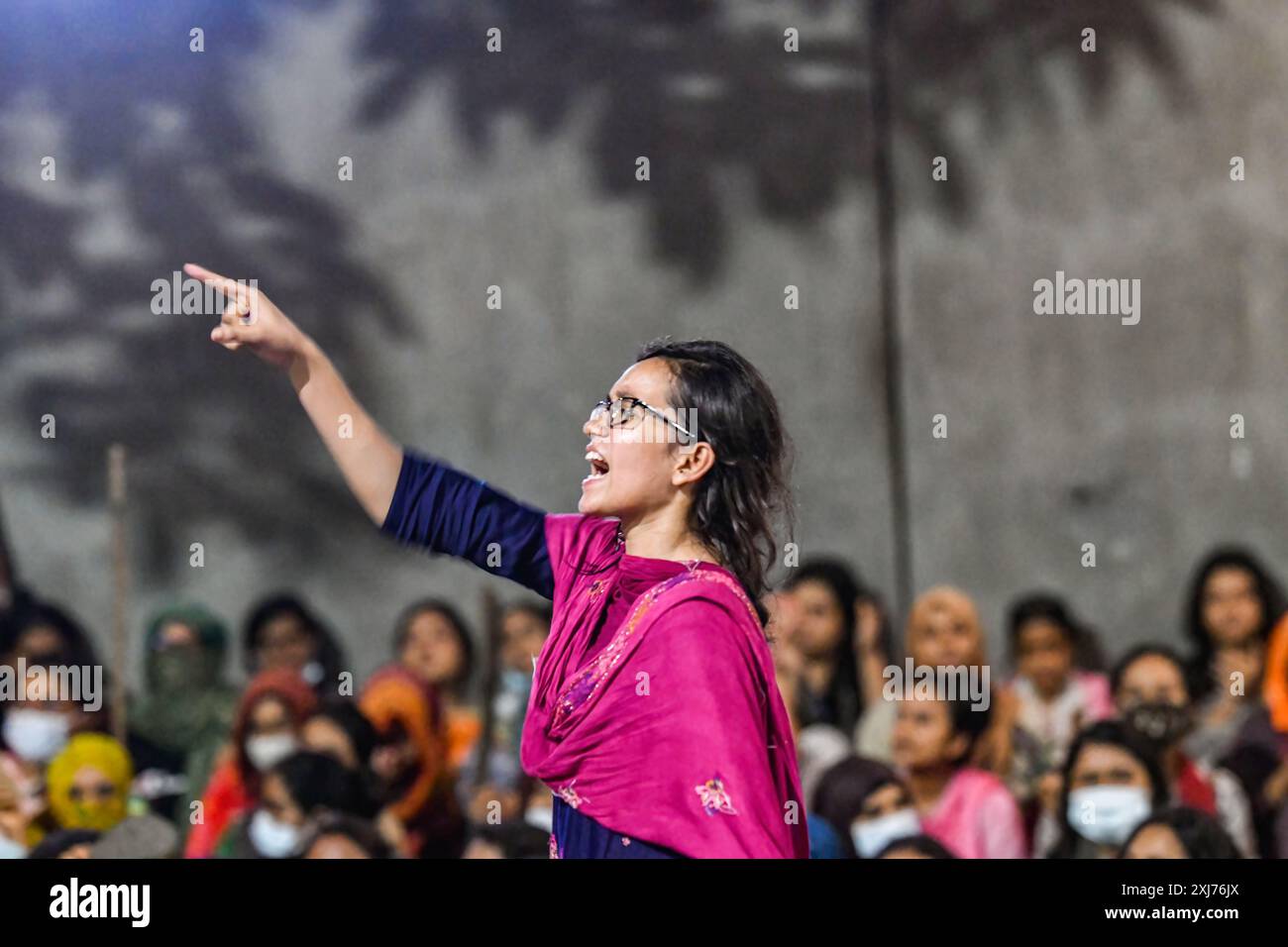 Dhaka, Bangladesh. 16th July, 2024. A female student shouts in front of ...
