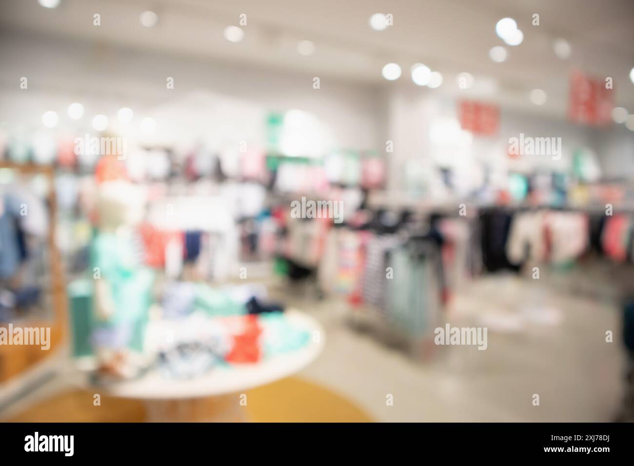 clothing store interior abstract blur background Stock Photo - Alamy