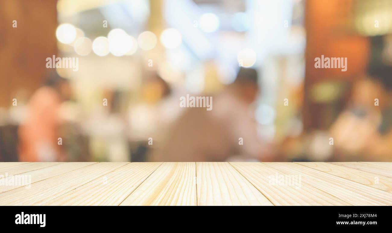 Empty Wood table top with Restaurant cafe or coffee shop interior with ...
