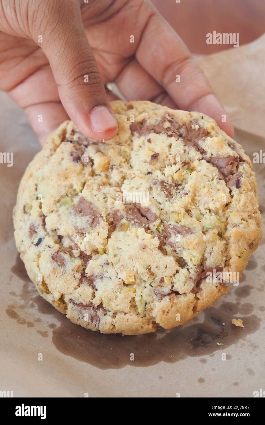 Closeup hand pick sweet cookie hi-res stock photography and images - Alamy