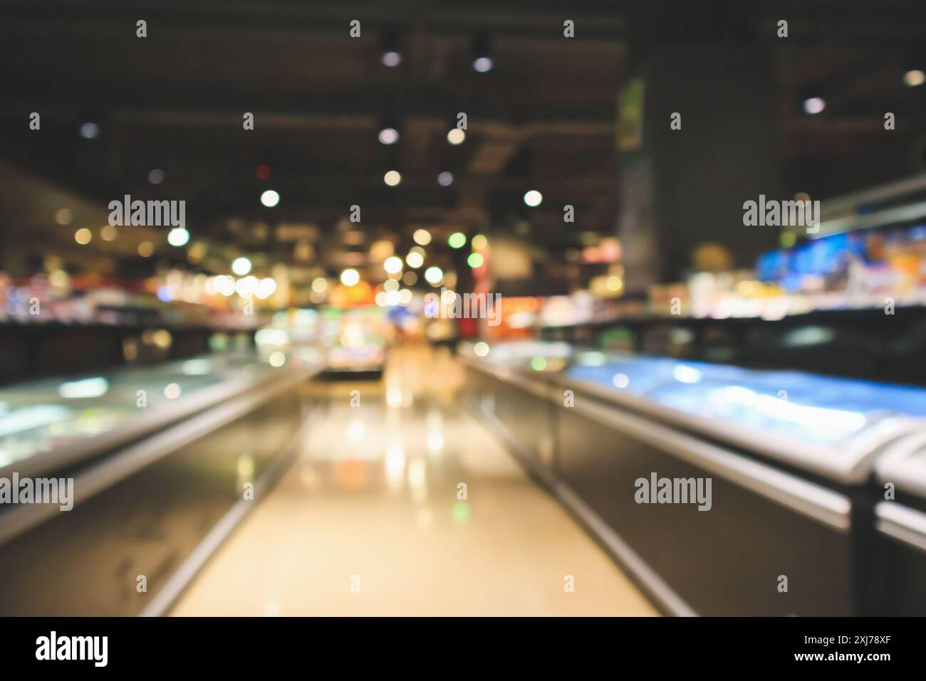 Abstract supermarket aisle interior blurred defocused background with ...