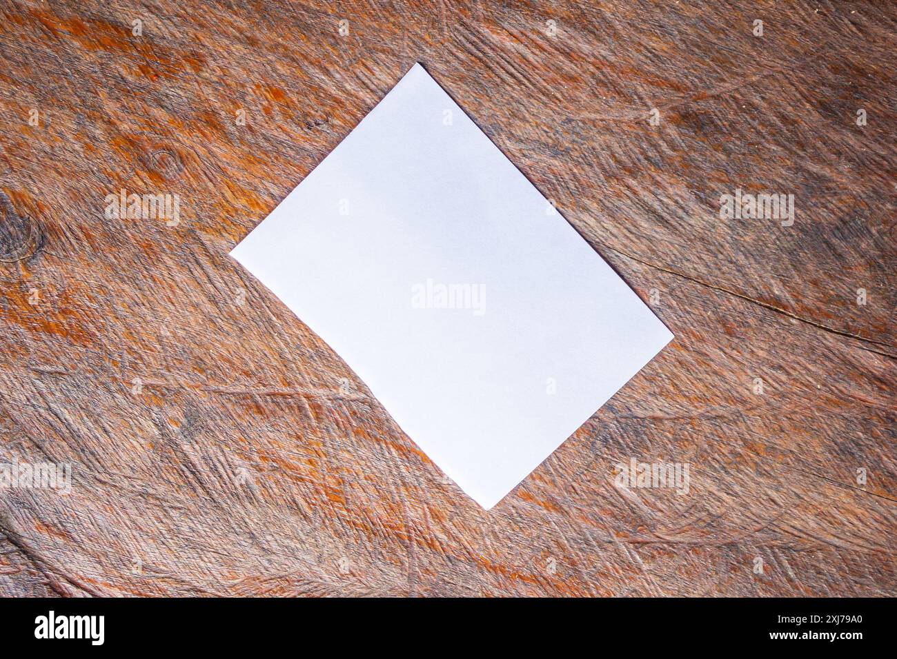 Blank white paper on old rustic wood table background Stock Photo - Alamy