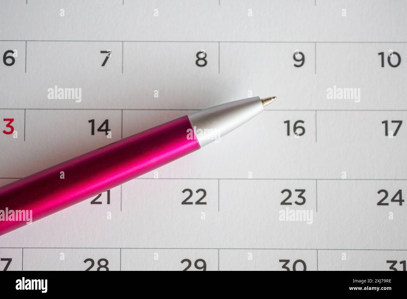 Calendar date page with pen on top Stock Photo - Alamy