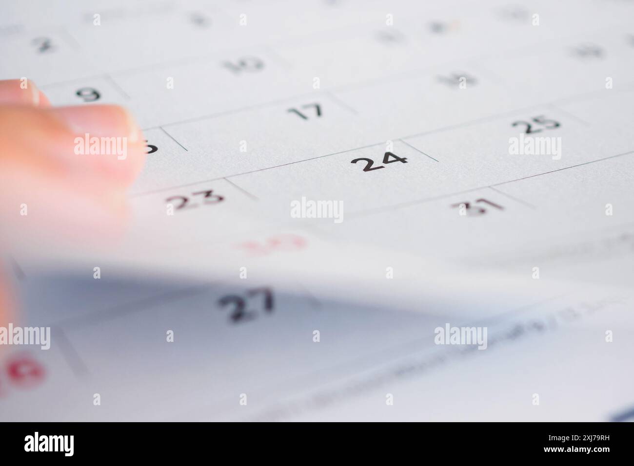 Hand hold calendar page flipping sheet close up background Stock Photo ...