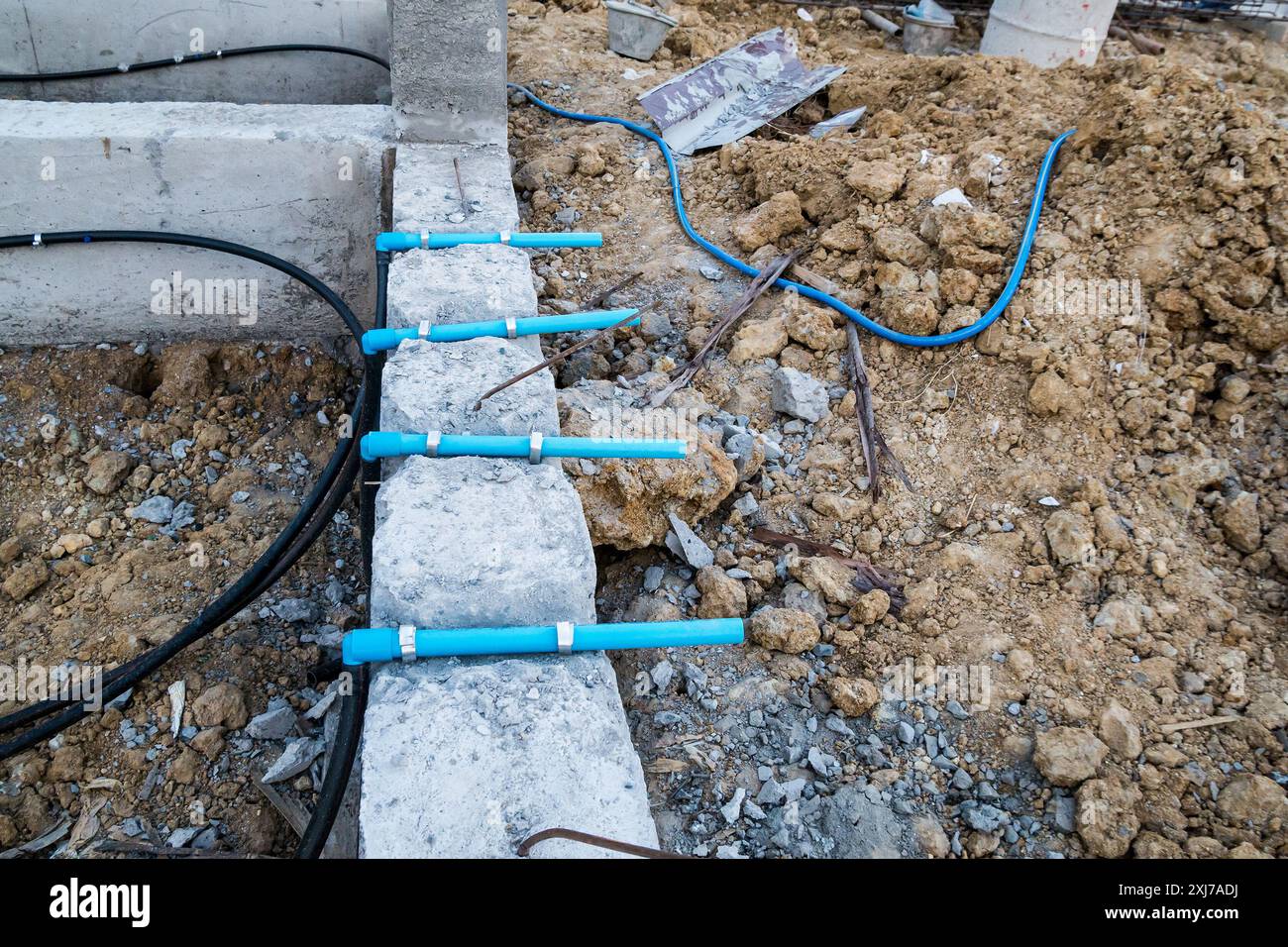 Pest control pipe system install at new house construction foundation ...